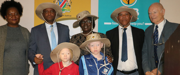 Local bank supports albinism sufferers, donates 250 sun protection hats ...